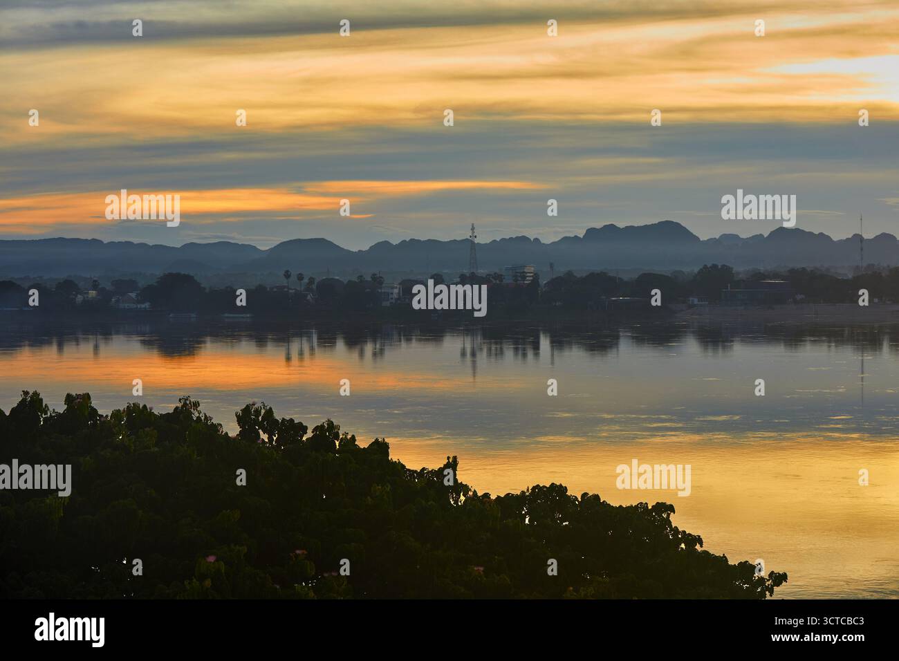 Sunset over border short of Mea-Kong river between Thailand and Laos ...