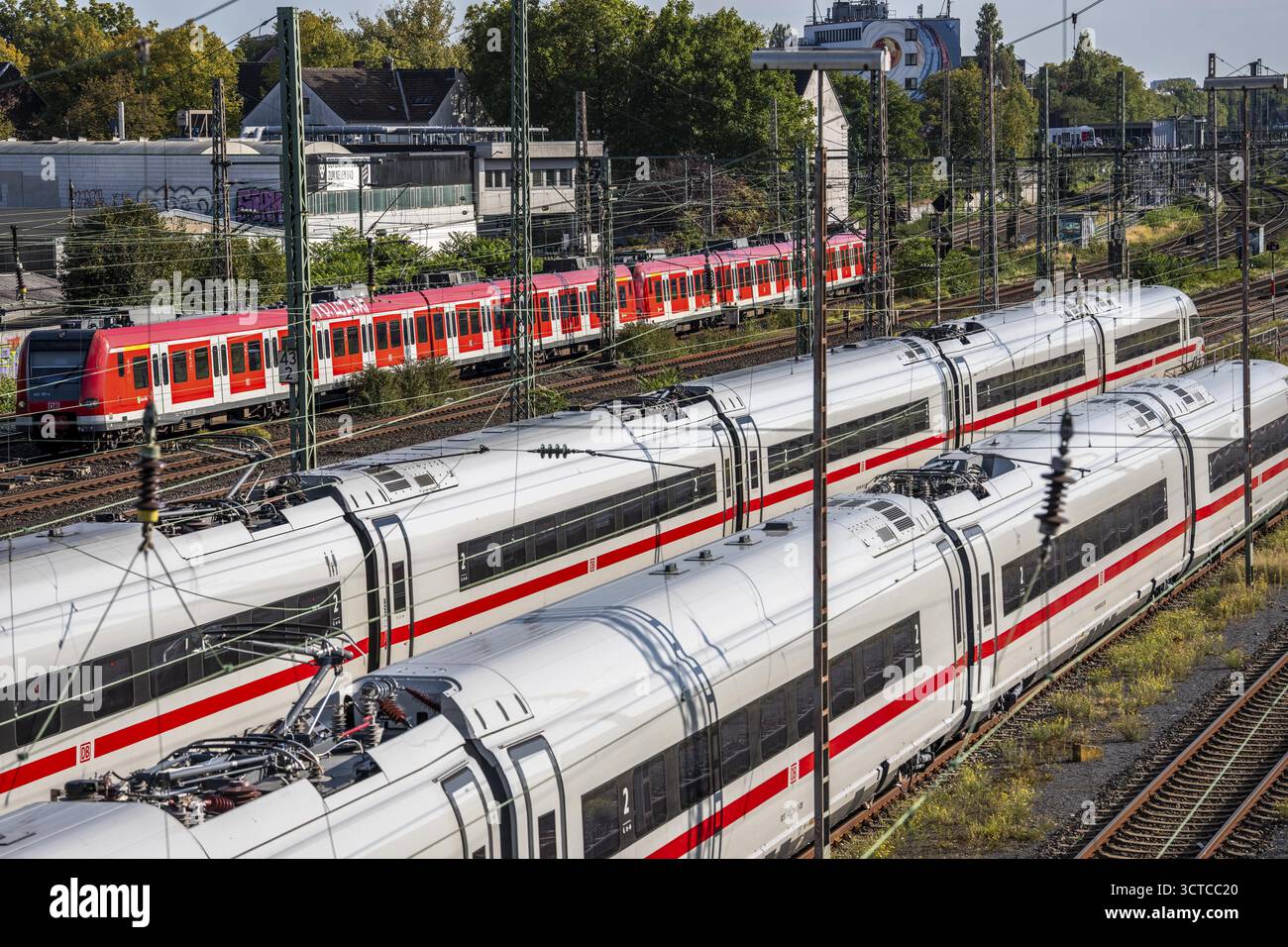 ICE trains on the railway line, S-Bahn train, north of Duesseldorf main ...
