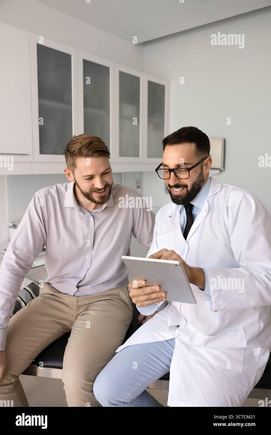 Male doctor reviewing medical history hi-res stock photography and ...