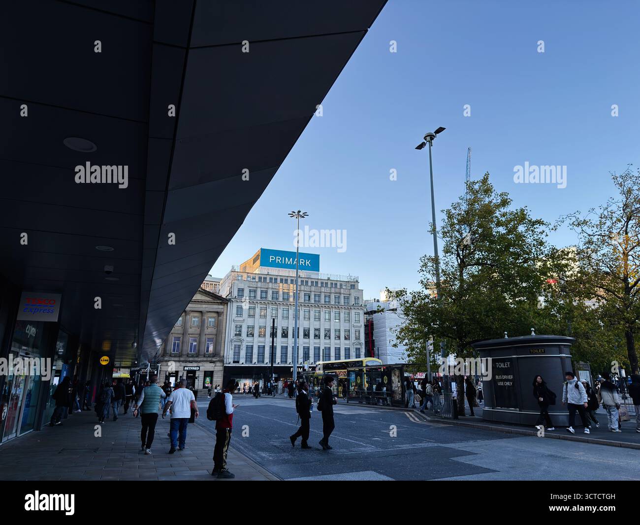 Manchester, UK - September 25, 2025: Urban street scene with shoppers ...