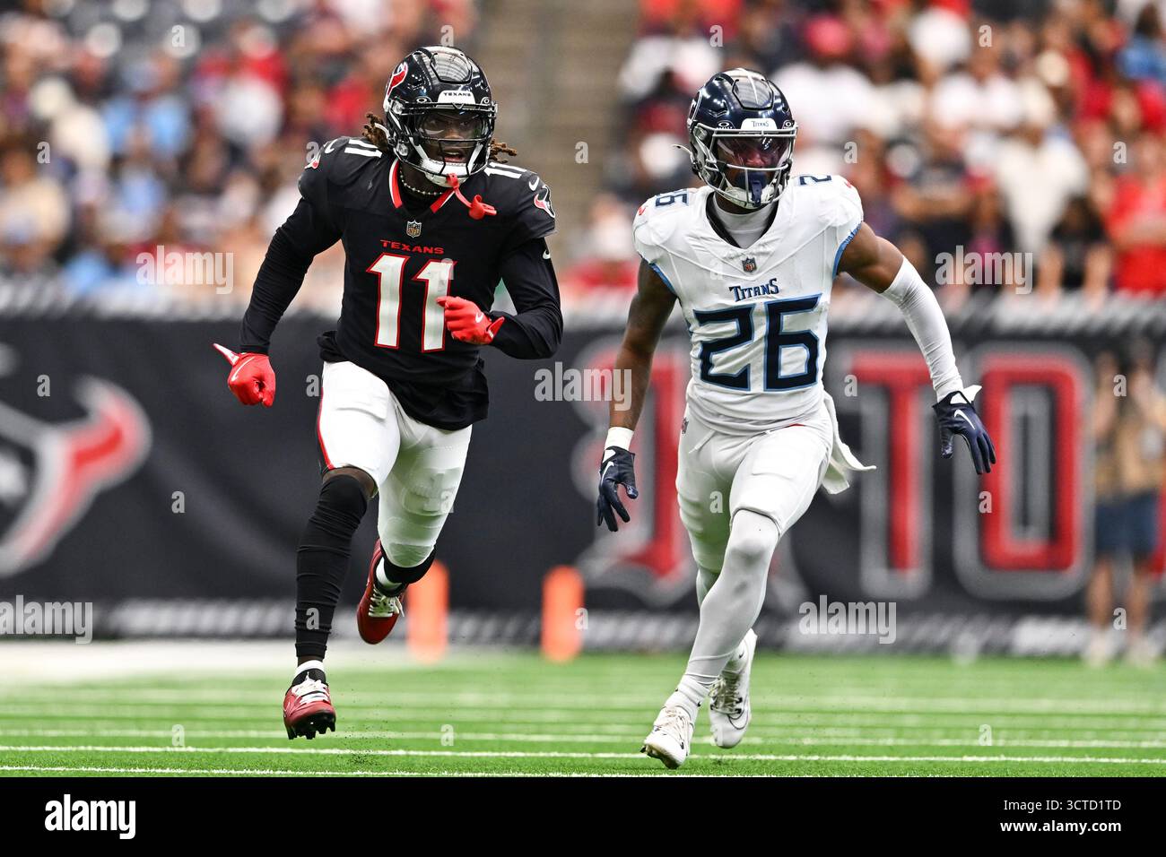 Houston Texans cornerback Tremon Smith (11) and Tennessee Titans cornerback Marcus Harris (26 ...