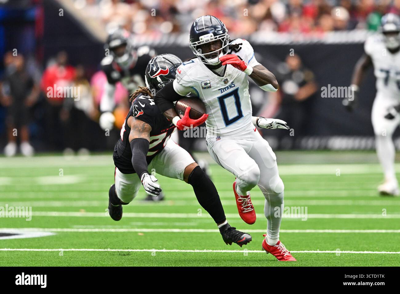 Houston Texans cornerback Derek Stingley Jr. (24) attempts to tackle Tennessee Titans wide ...