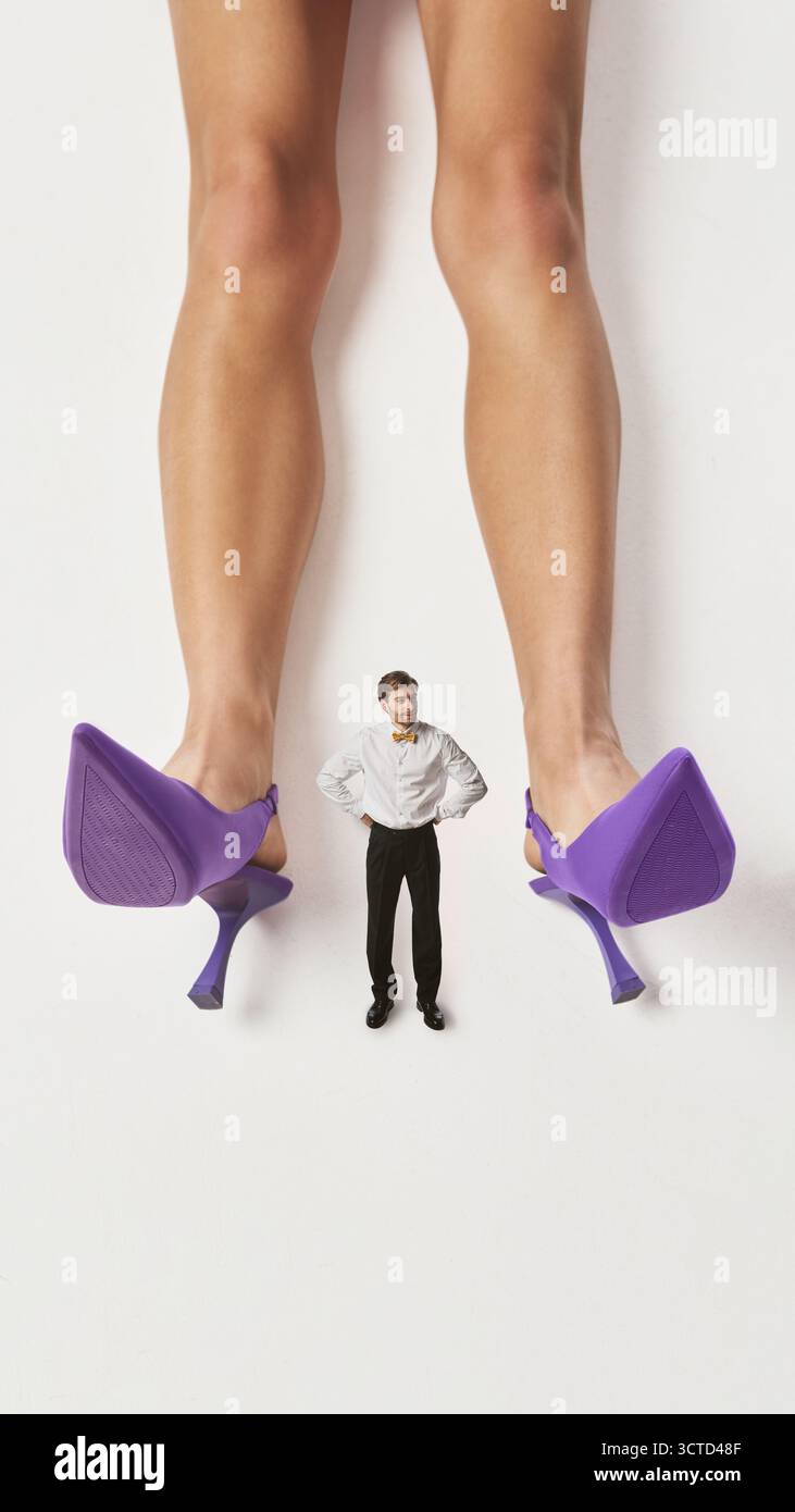 Surreal collage art. Tiny man standing between woman purple heels in ...