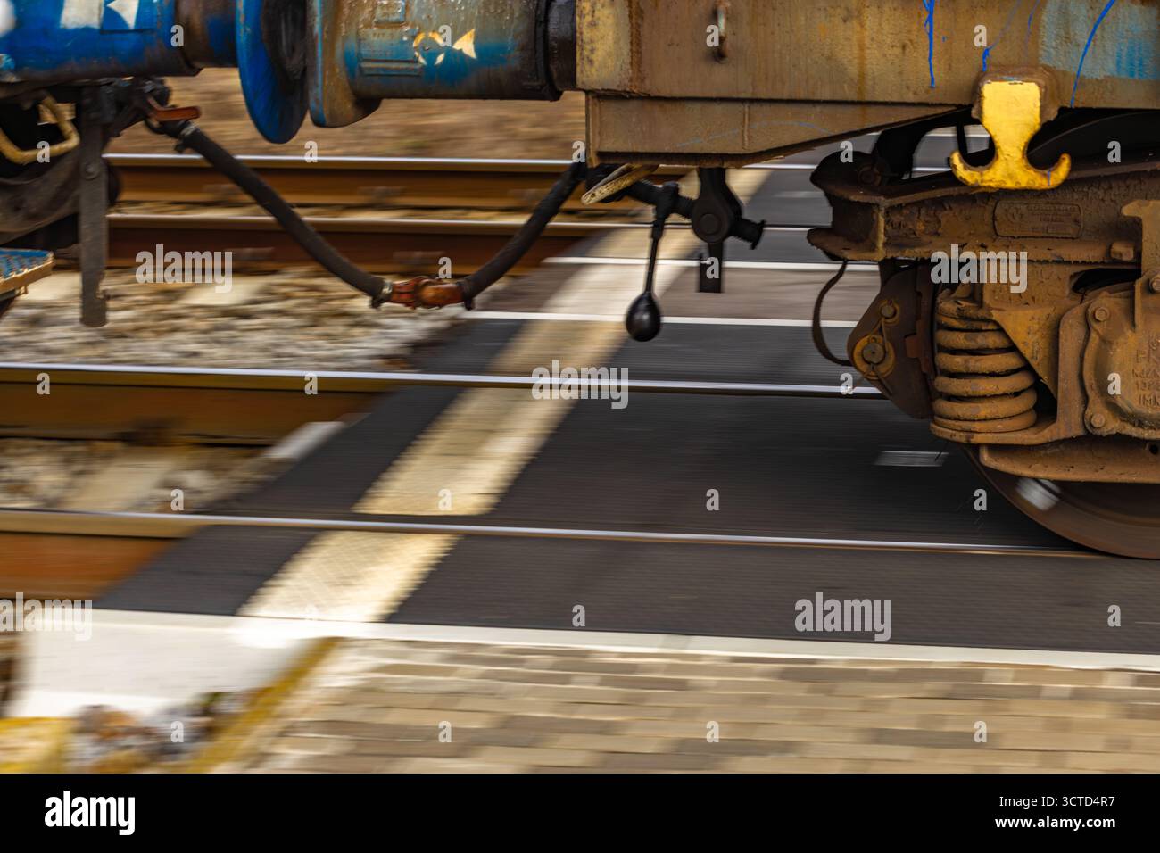 The rapidly rotating wheels of a railway carriage, a pedestrian entered ...