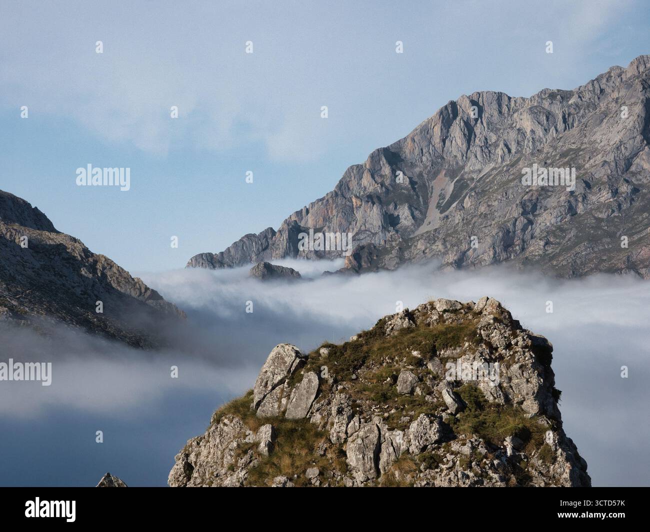 Misty valley and prominent mountain rock - Rugged mountain landscape ...