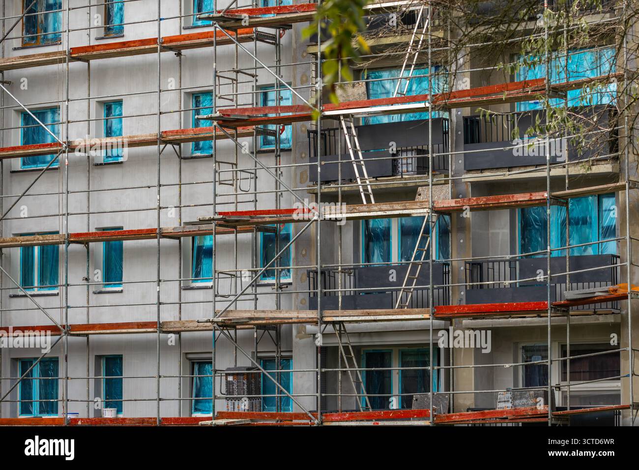 Aluminum scaffolding installed on the facade of a tall building, walls ...