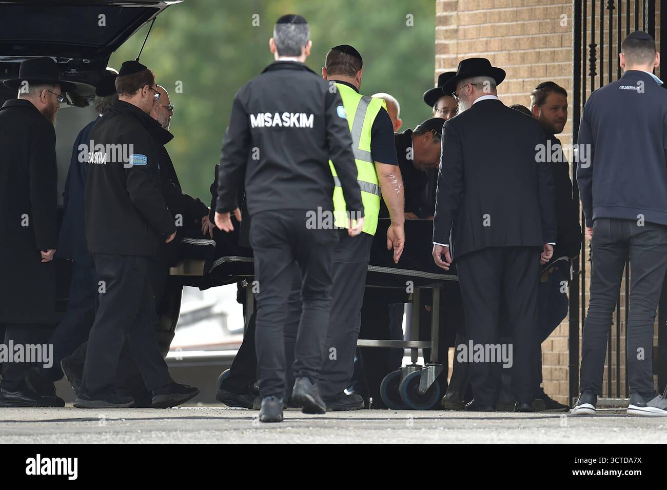 The coffin is taken in to the funeral of Adrian Daulby at Agecroft ...