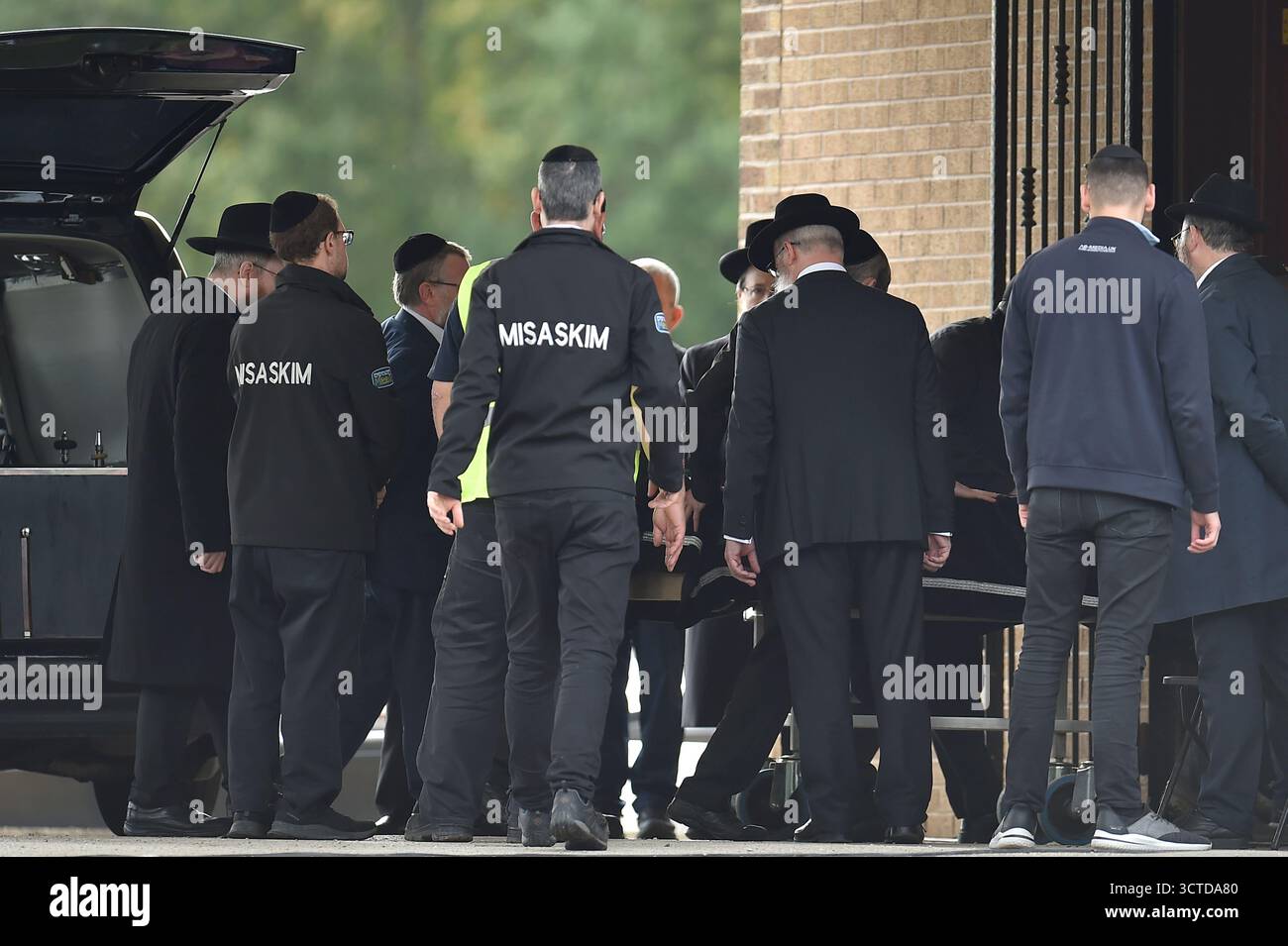 The coffin is taken in to the funeral of Adrian Daulby at Agecroft ...