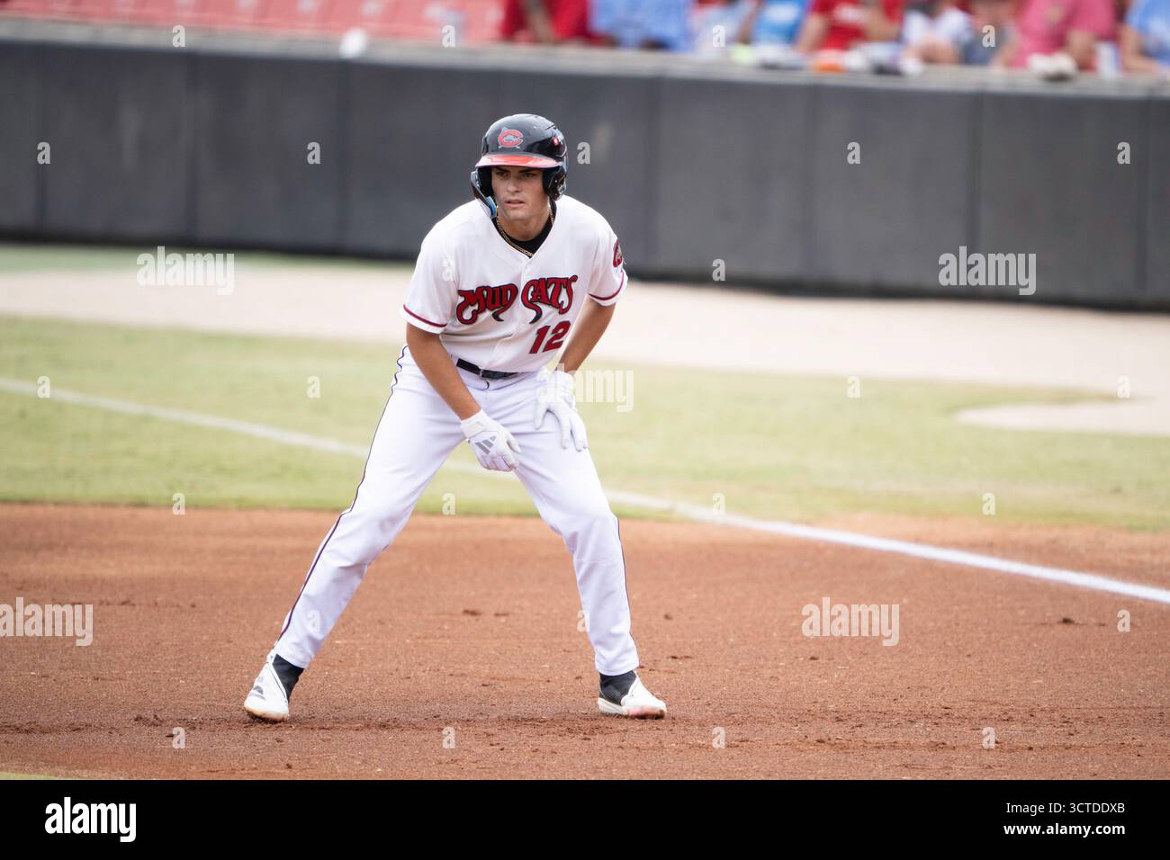 Brady Ebel (12) of the Carolina Mudcats takes his lead off of first ...