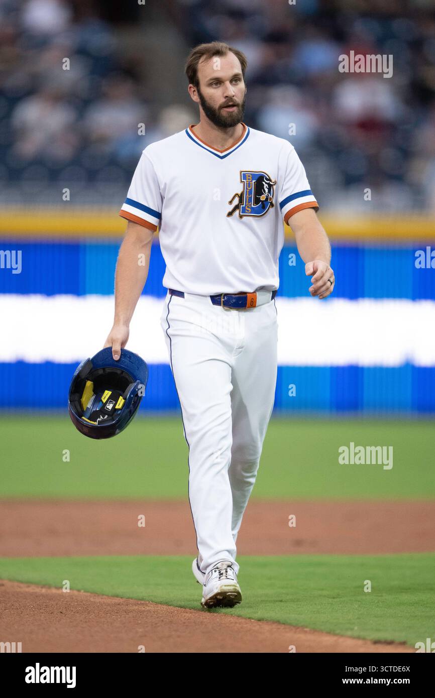 Tristan Peters (6) of the Durham Bulls returns to the dugout between ...