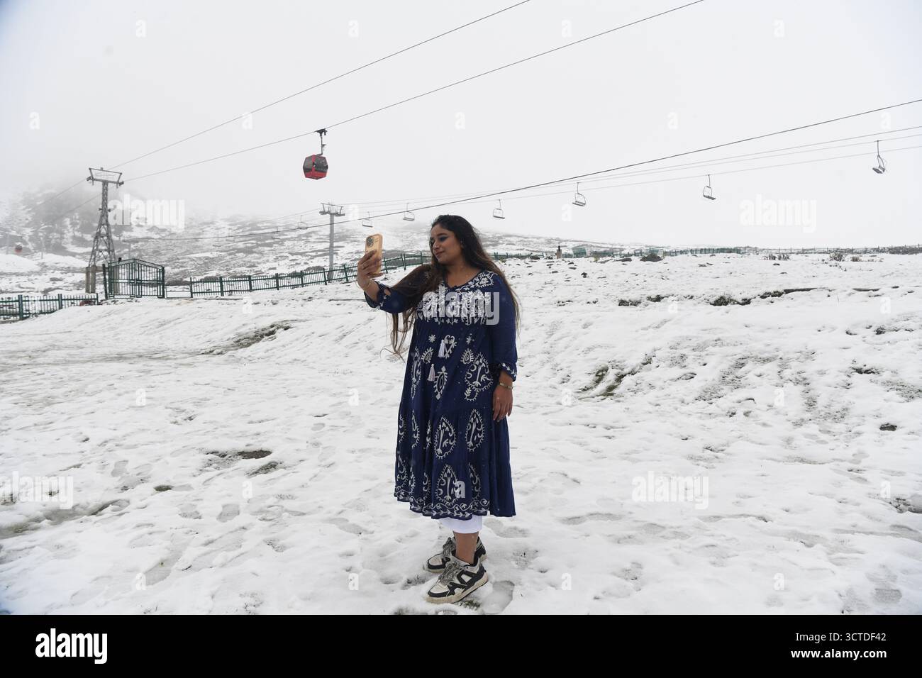 October 6, 2025, Gulmarg, Jammu and Kashmir, India: A tourist takes a ...