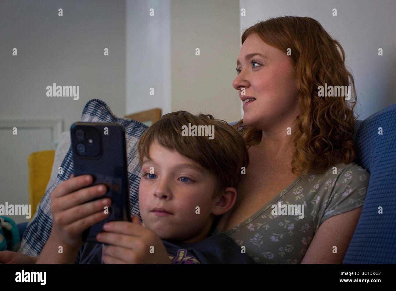 Taylor Moyer watches TV with her oldest son Liam at home, Sunday, Oct ...