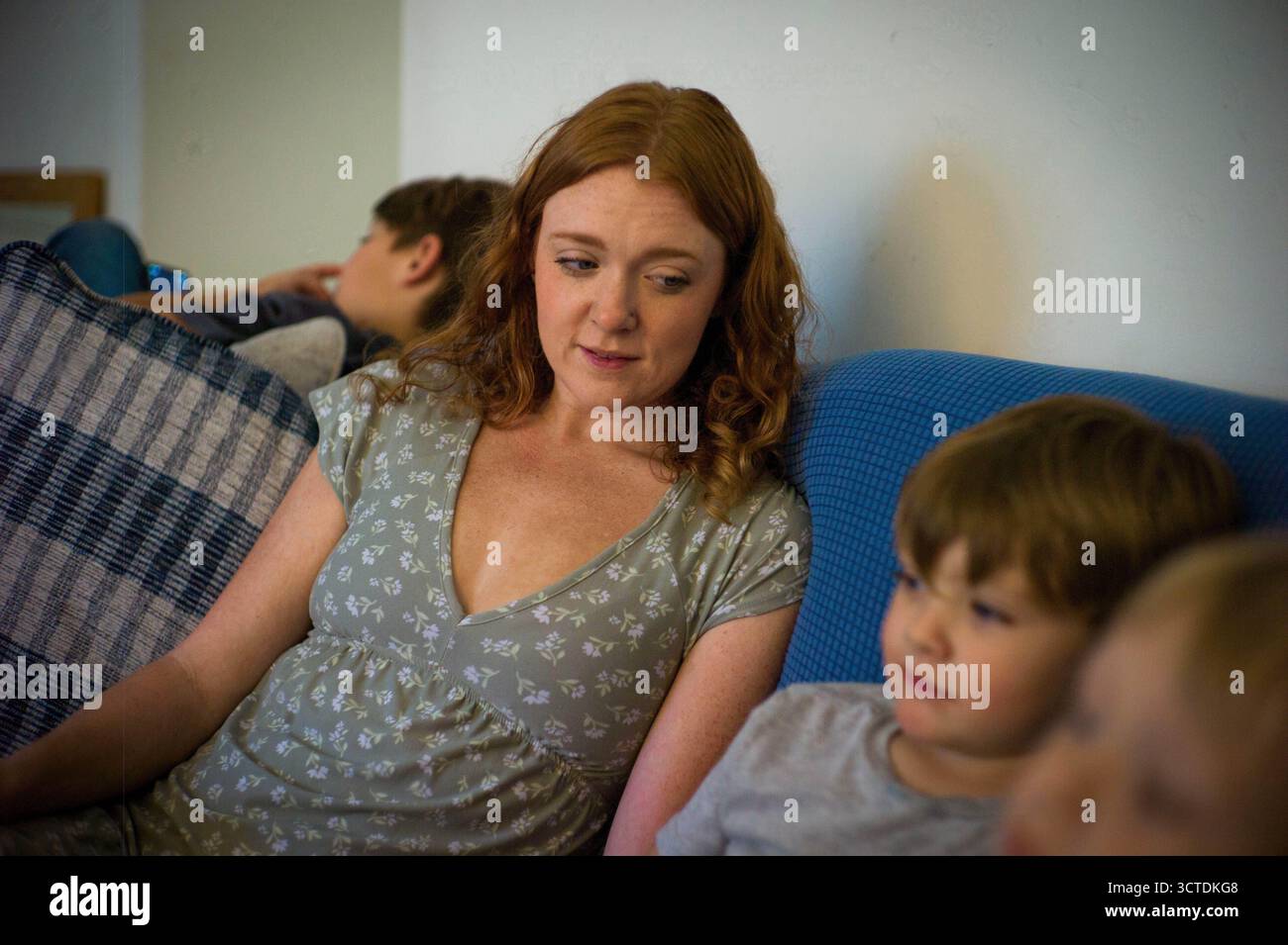 Taylor Moyer watches TV with her children Liam, Colton, and Bradley at ...