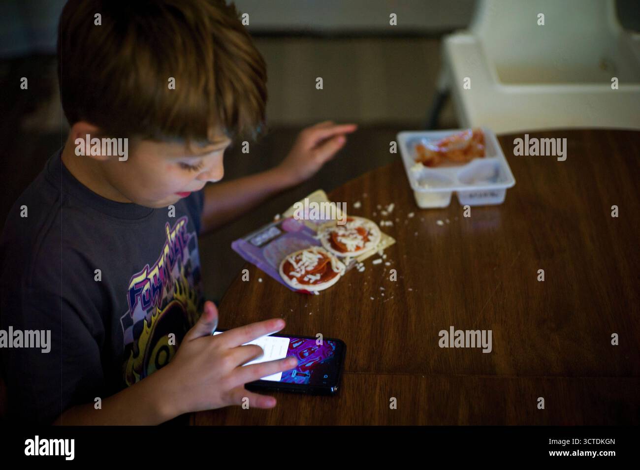 Taylor Moyer's oldest son Liam eats a Lunchable while playing with a ...