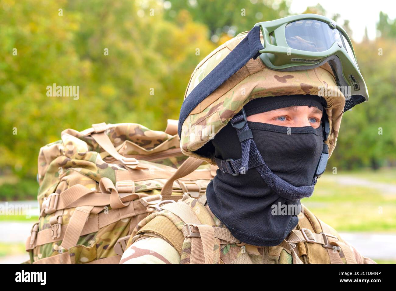 Special Forces soldier. Military man in camouflage and helmet with a ...