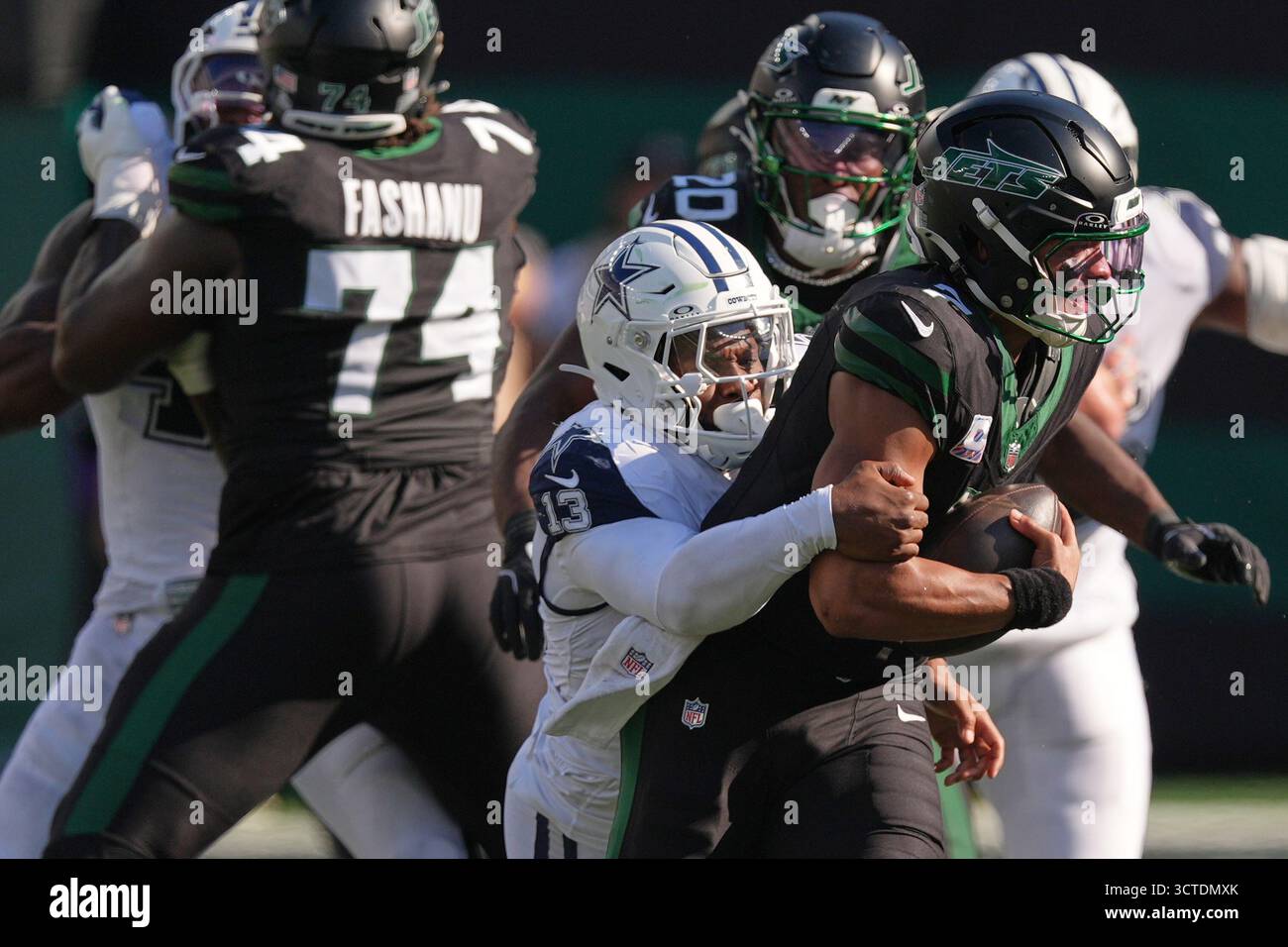 Dallas Cowboys' Dante Fowler Jr., center left, sacks New York Jets ...
