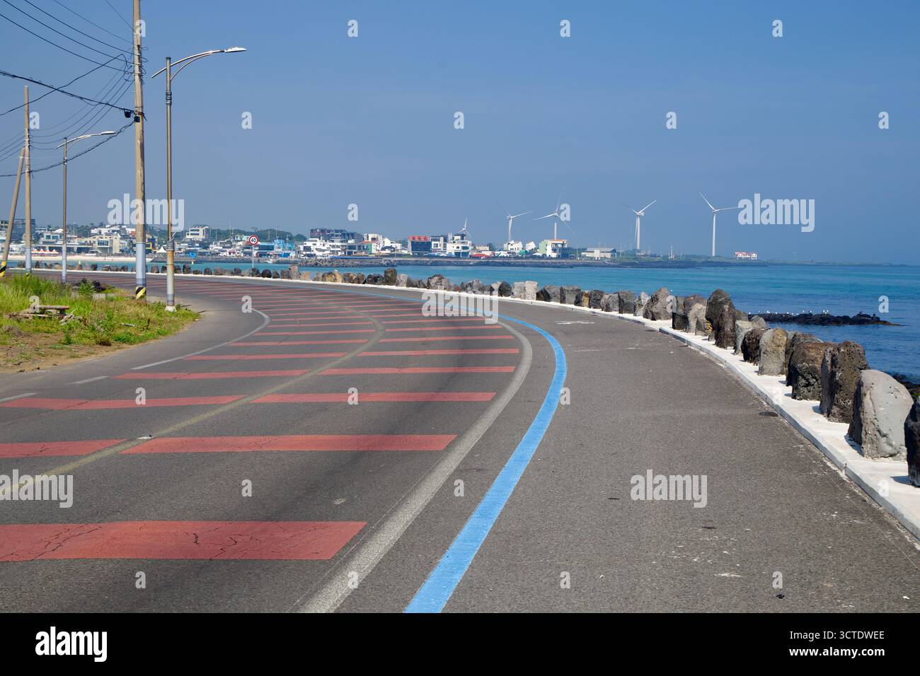The coastal road and bike lane approach Woljeongri Port and Beach, with ...