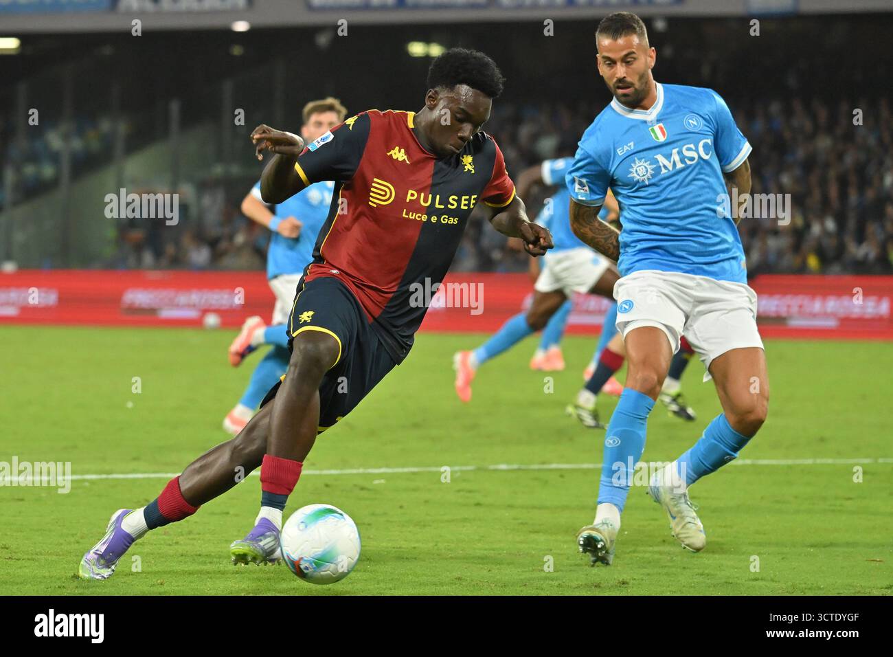 Jeff Ekhator of Genoa,Leonardo Spinazzola of SSC Napoli during the ...