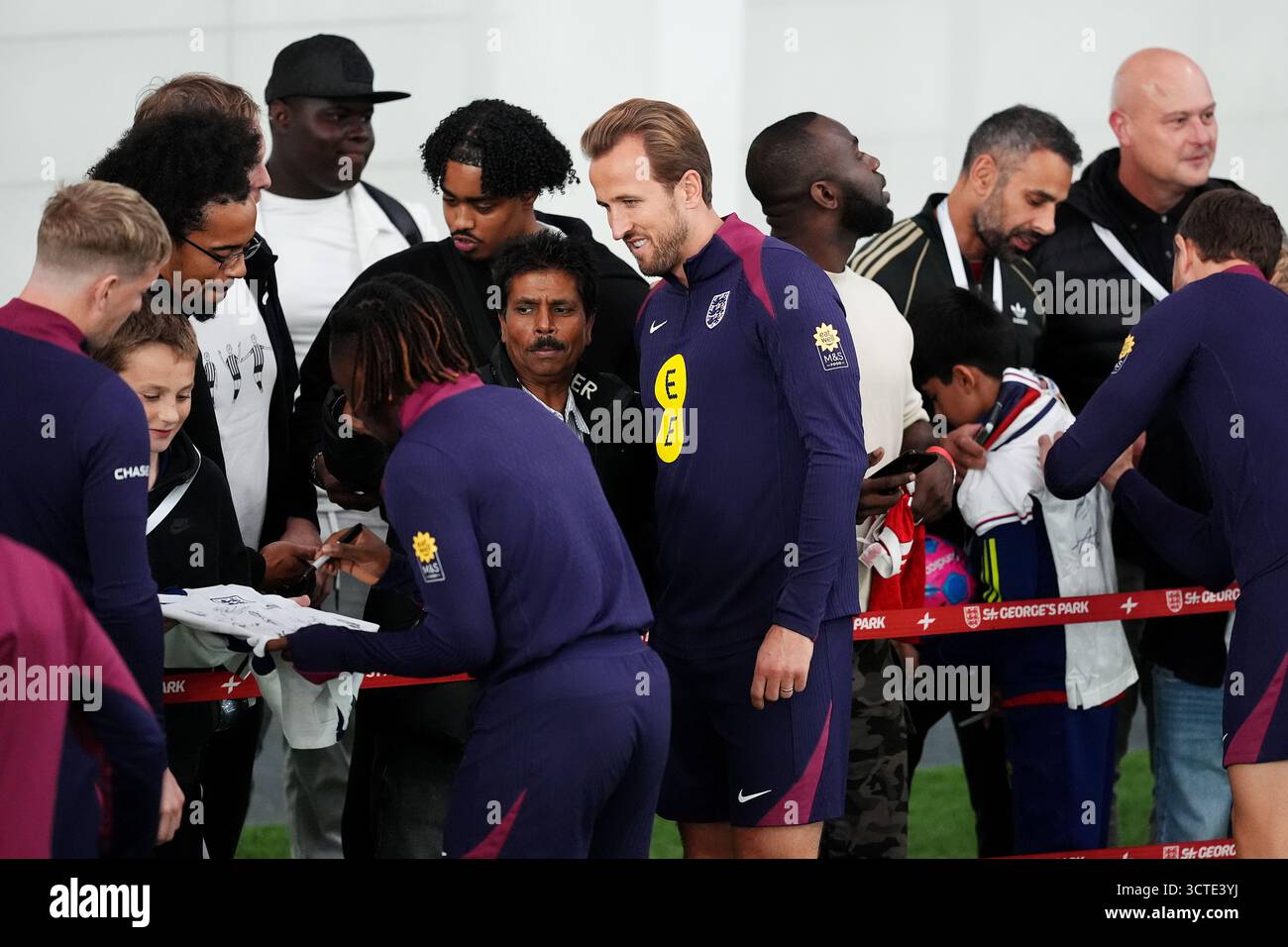 England's Harry Kane (centre) poses for a photo during a training session at St George's Park ...