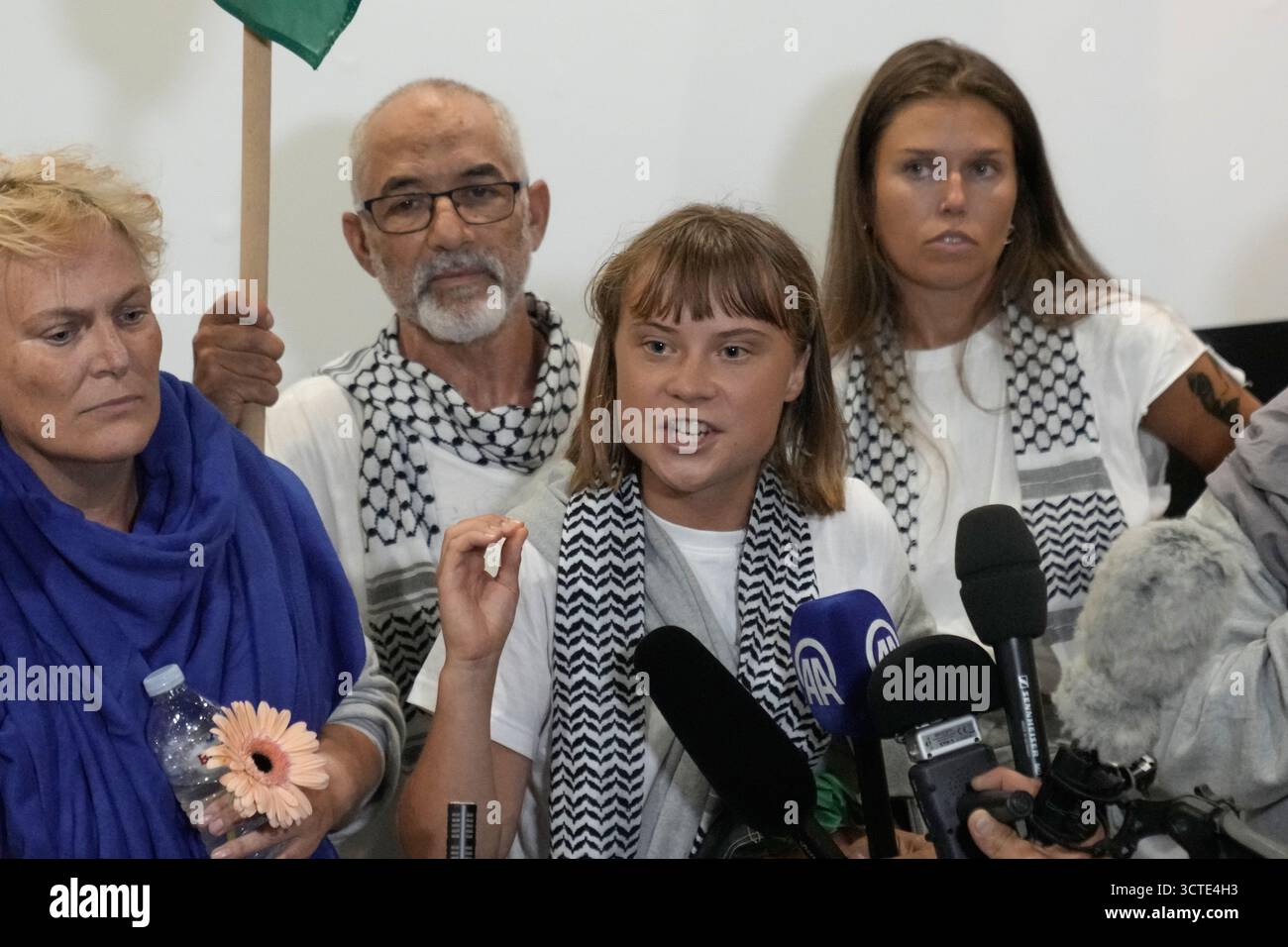 Swedish activist Greta Thunberg speaks as she arrives at the ...