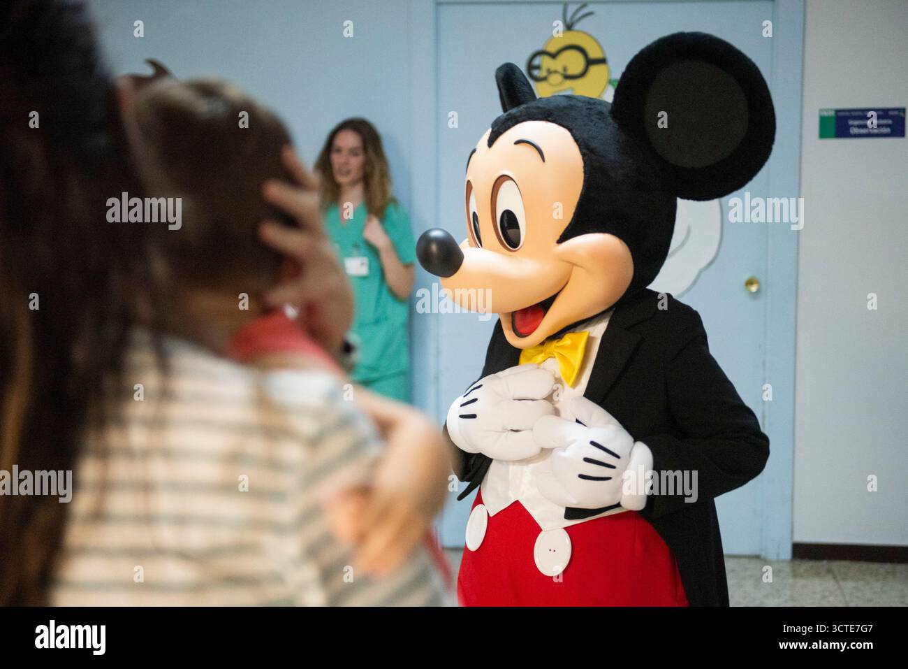 Mickey Mouse greets children in the pediatric area of the Hospital ...