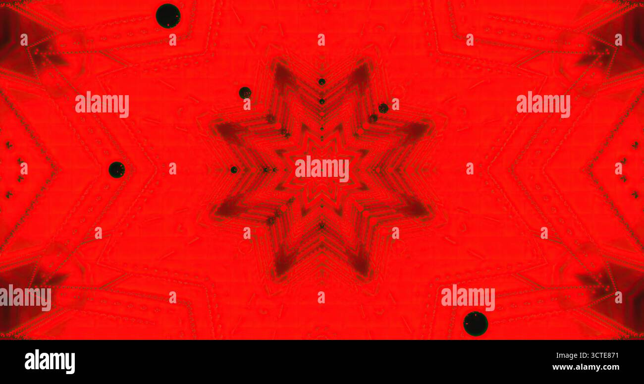 A striking kaleidoscope pattern featuring bold red hues and complex ...