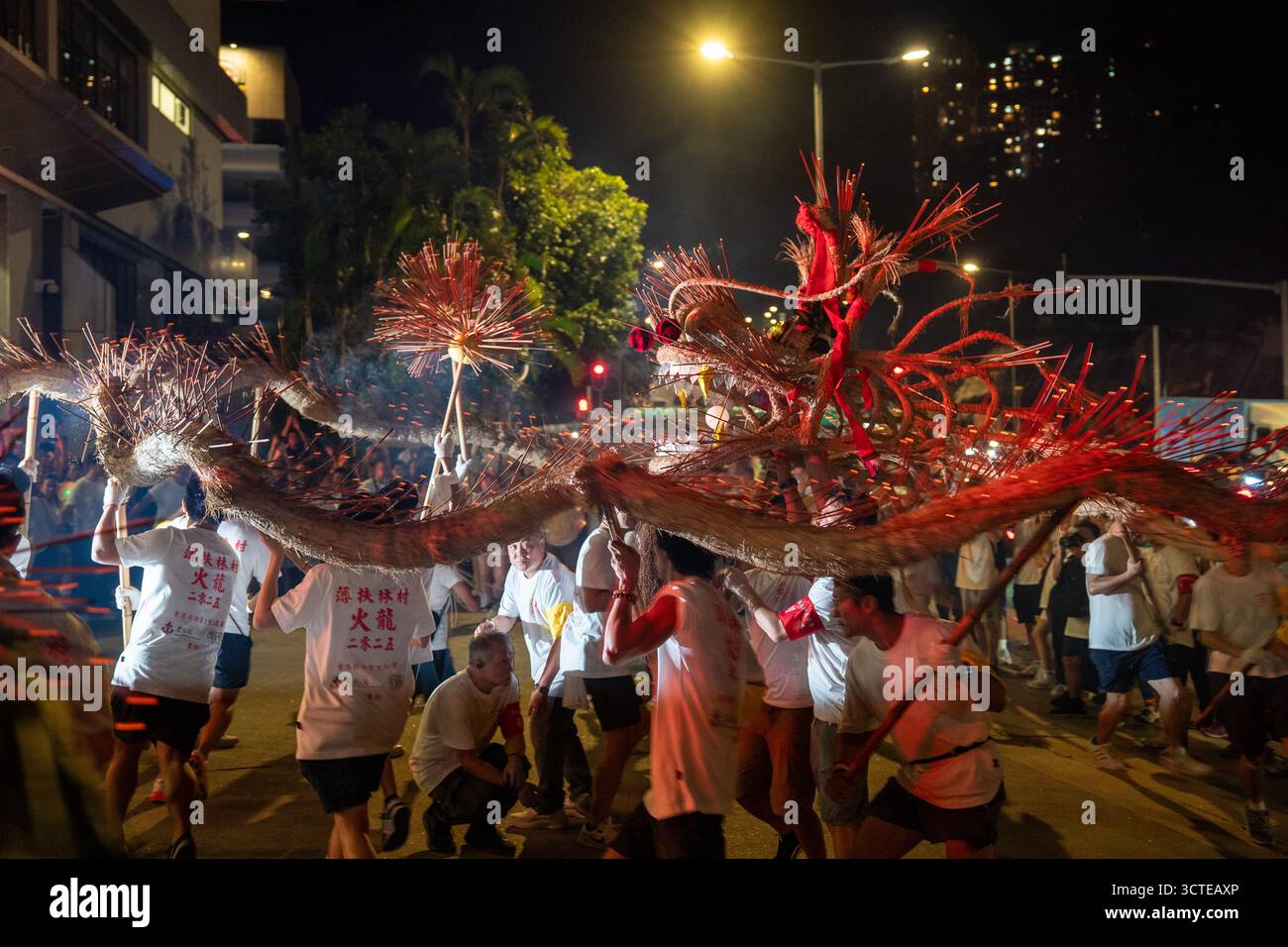 Performers performing the fire dragon dance outside a fire station on ...