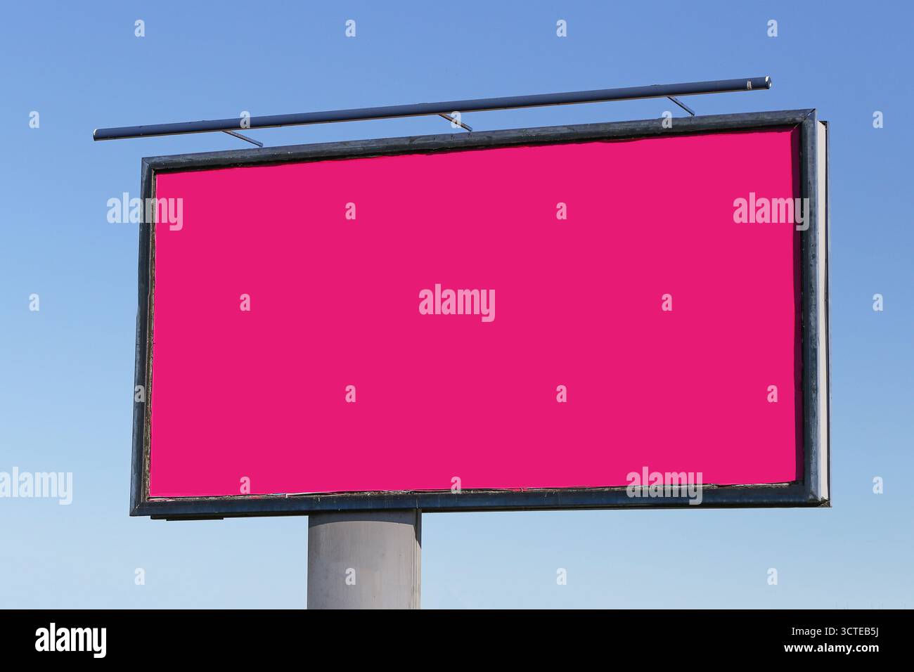 Large outdoor billboard with bright pink blank background ready for ...