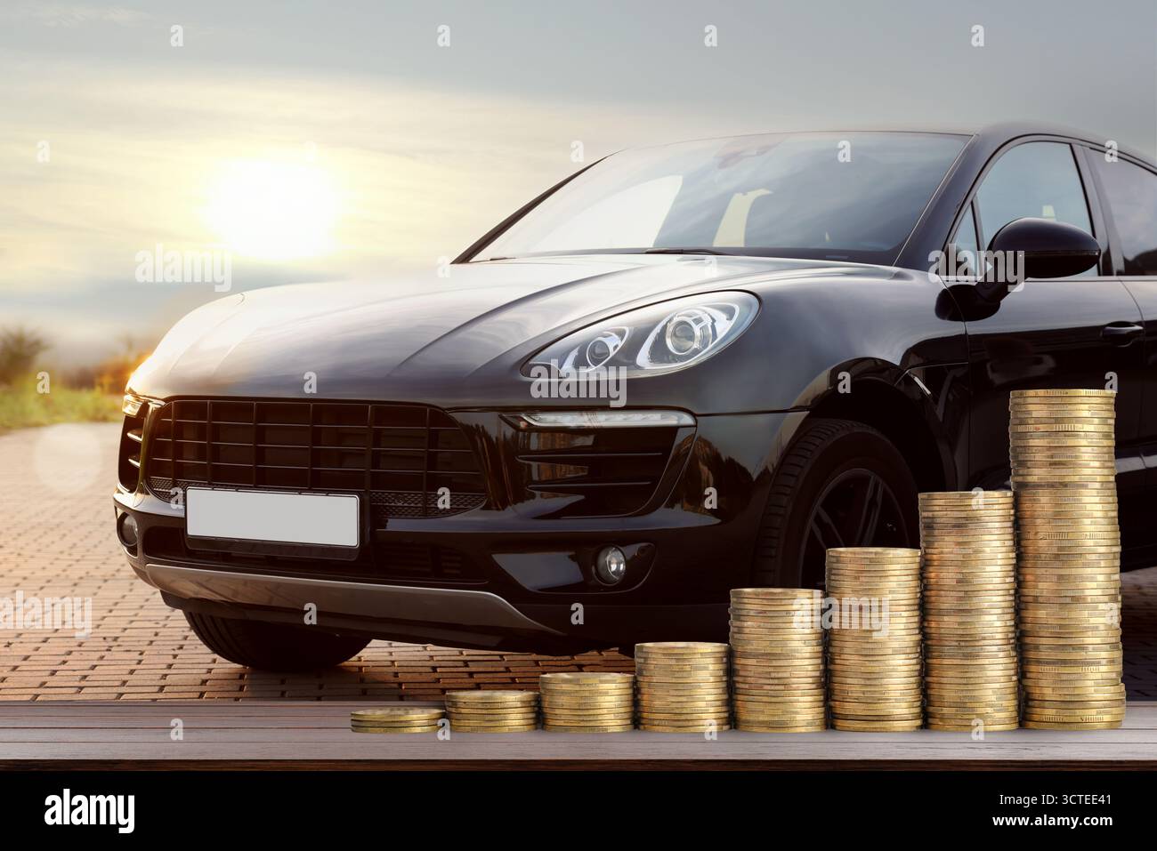 Stacked coins against car outdoors. Save money for vehicle Stock Photo ...