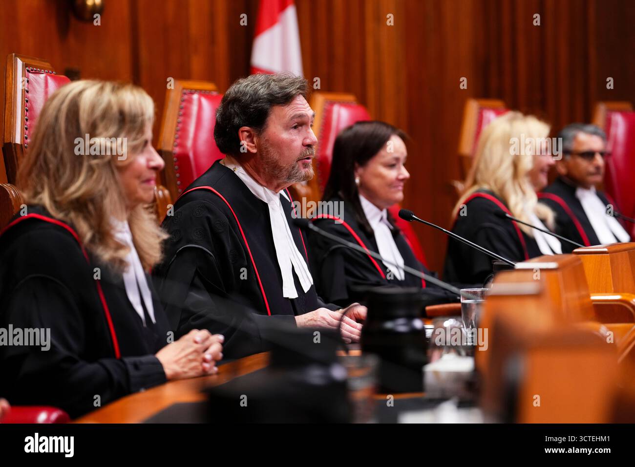 Chief Justice Wagner speaks alongside his fellow Supreme Court of ...