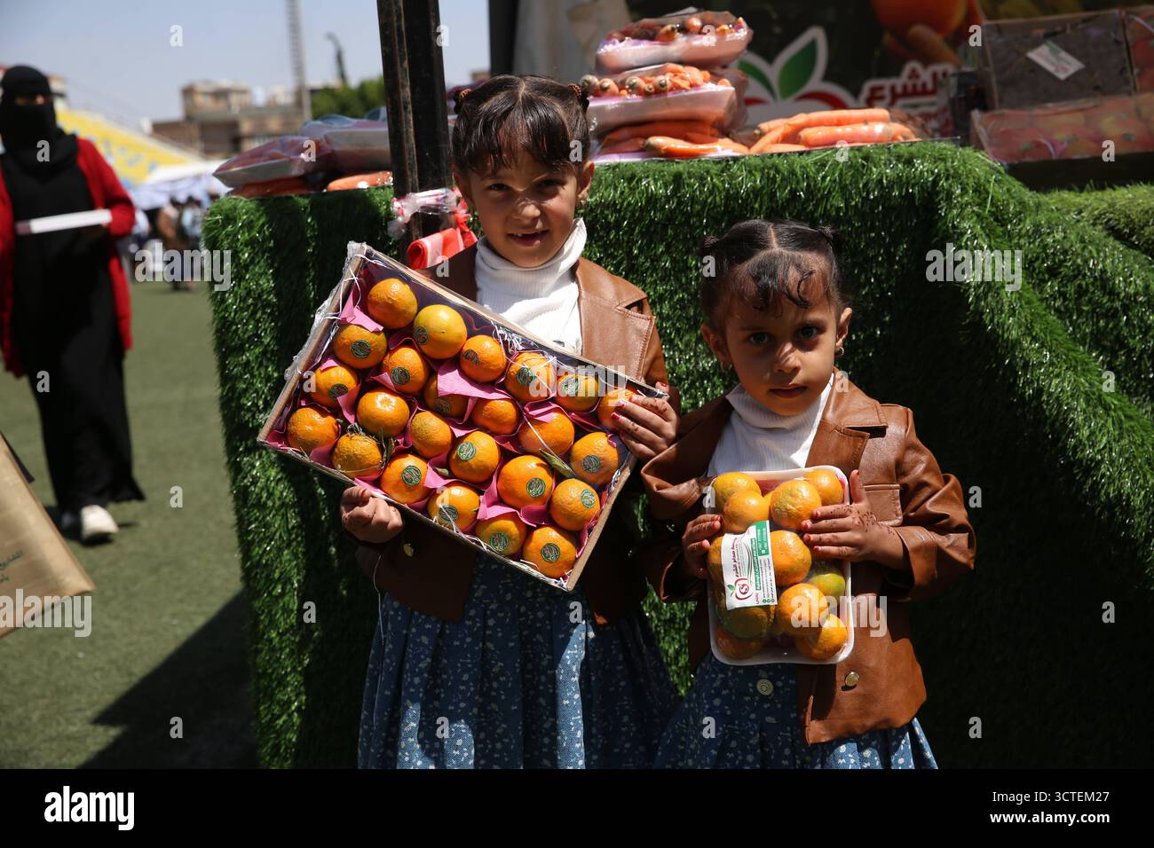 Fruit fair held in Sana a to boost local production Kids hold a baskets ...