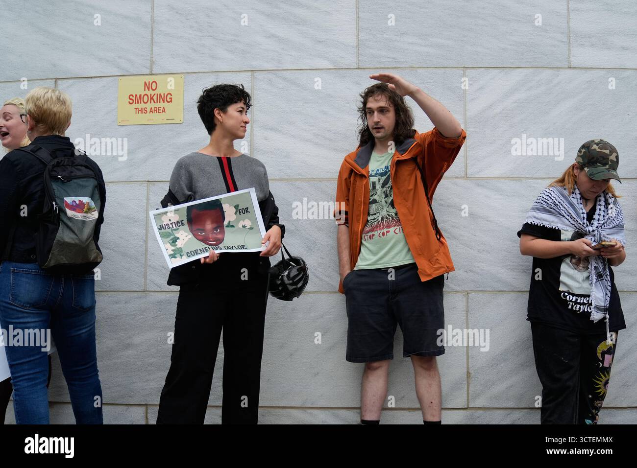 People gather for a rally for Cornelius Taylor at the Atlanta City Hall ...