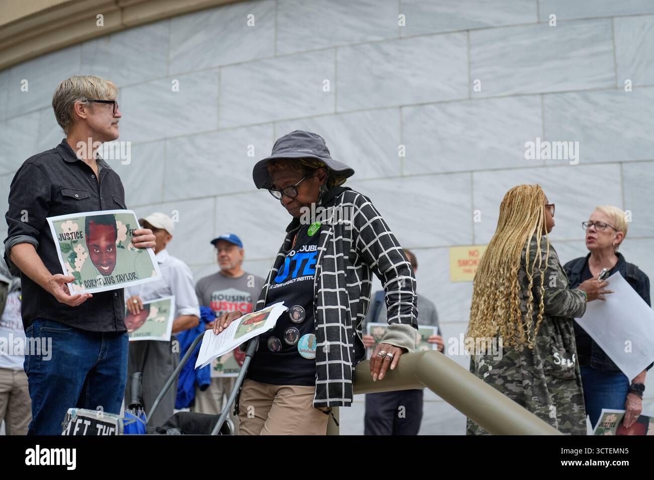 People gather for a rally for Cornelius Taylor at the Atlanta City Hall ...