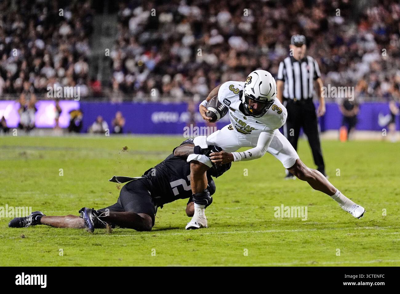 Colorado quarterback Kaidon Salter (3) attempts to break a tackle by ...