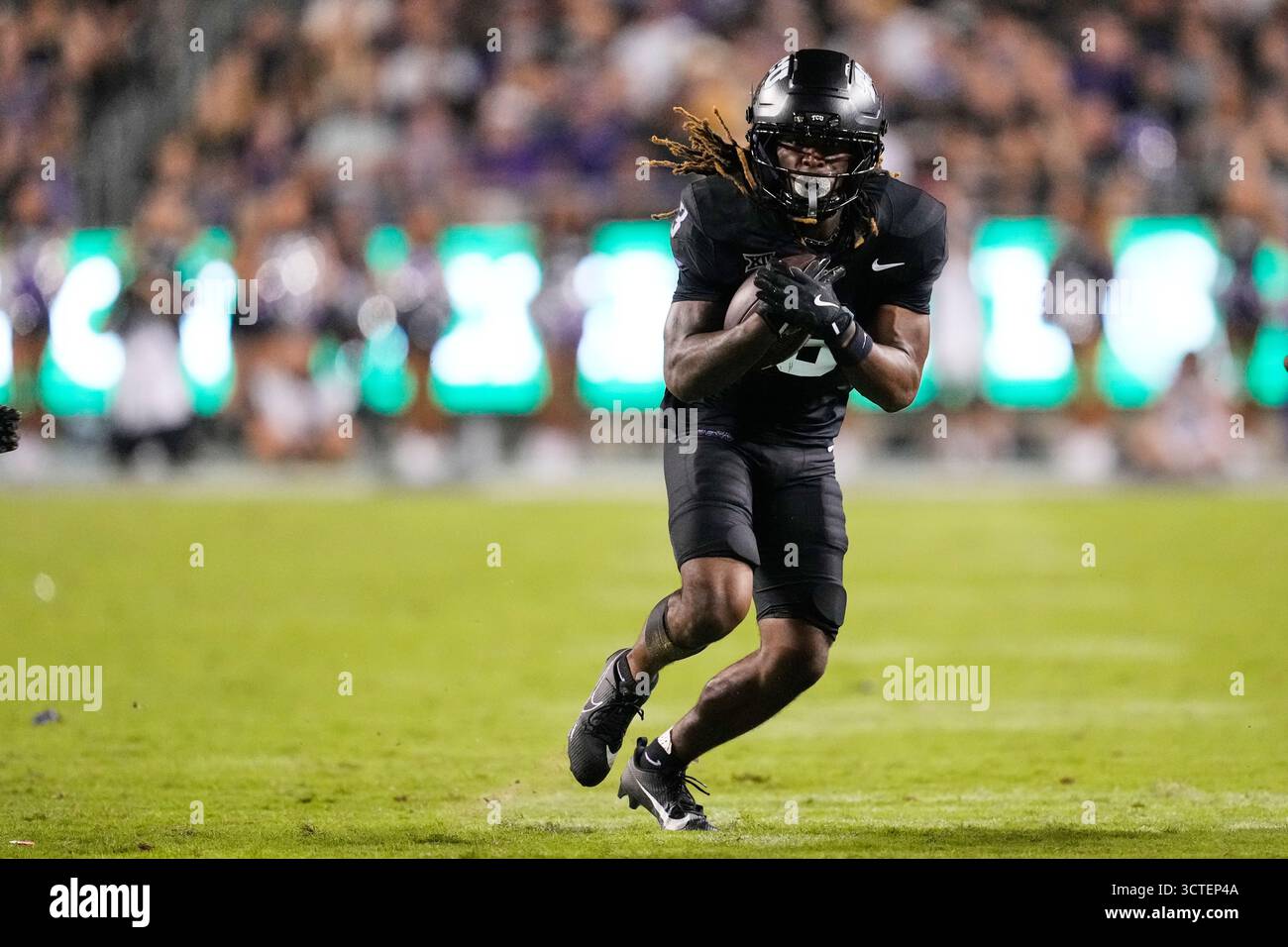 TCU wide receiver Major Everhart (3) runs the ball during an NCAA ...