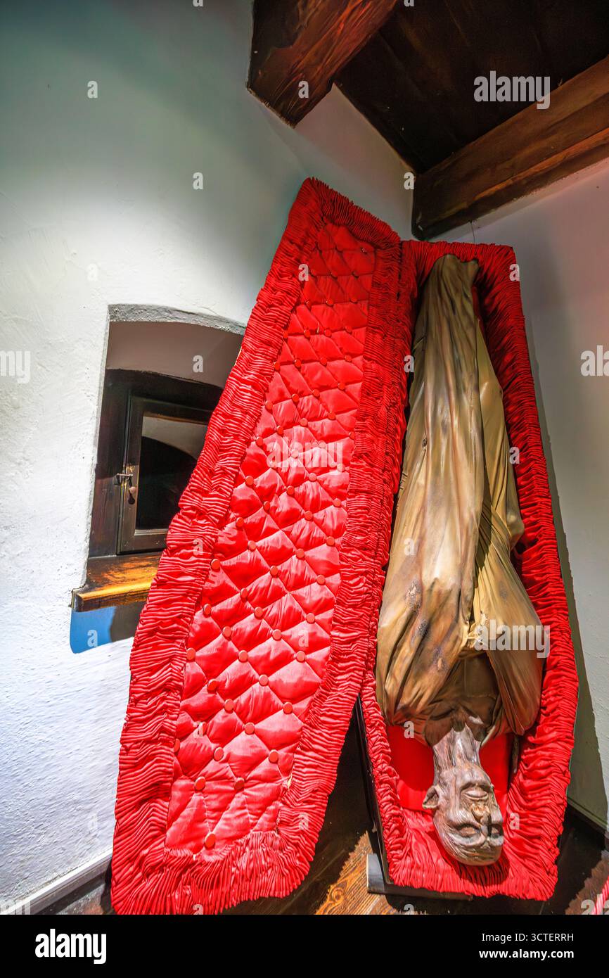Transylvania, Romania, Aug 12, 2025: Replica of Dracula the vampire with red-lined coffin ...