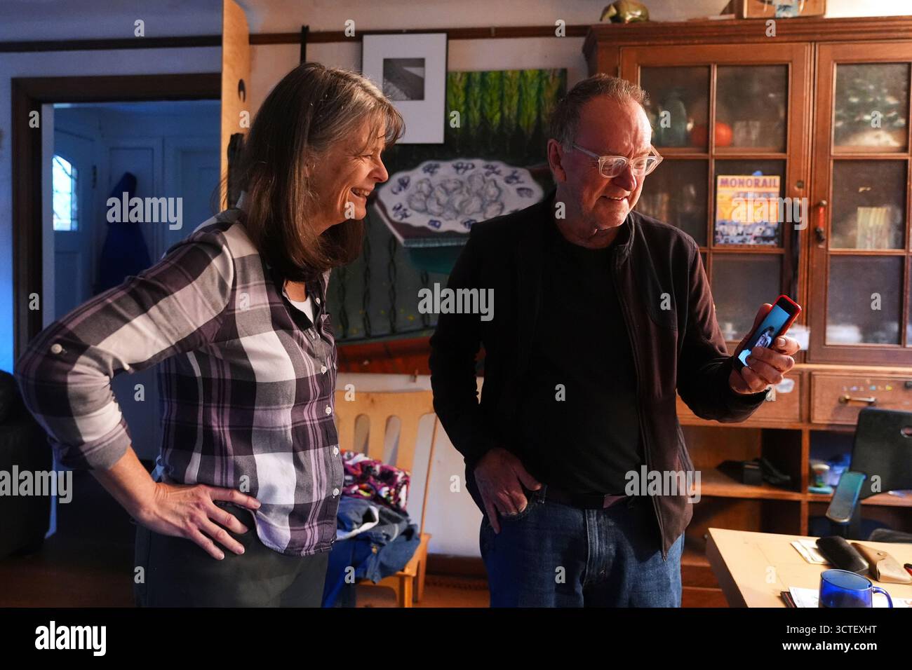 Mary E. Brunkow and her husband Ross Colquhoun talk with one of their ...
