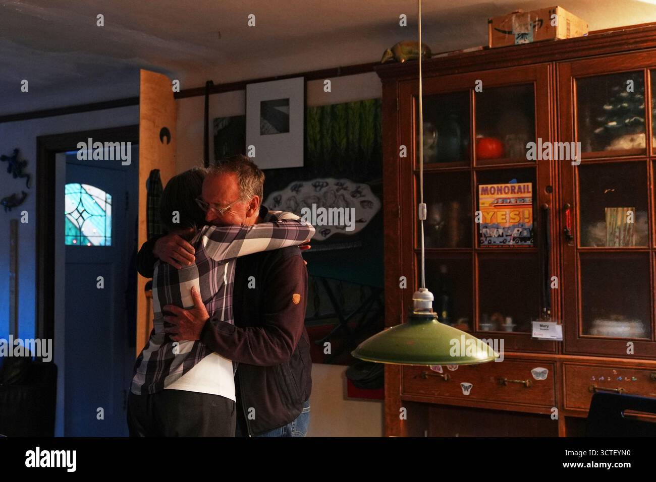 Mary E. Brunkow and her husband Ross Colquhoun embrace while ...