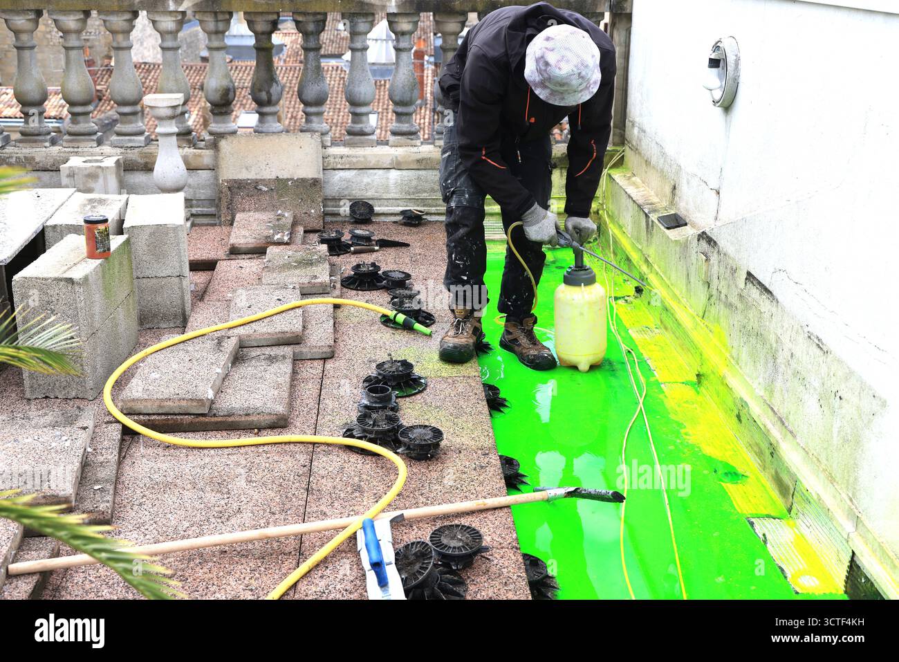 Search for leaks and water infiltration on a roof terrace using colored ...