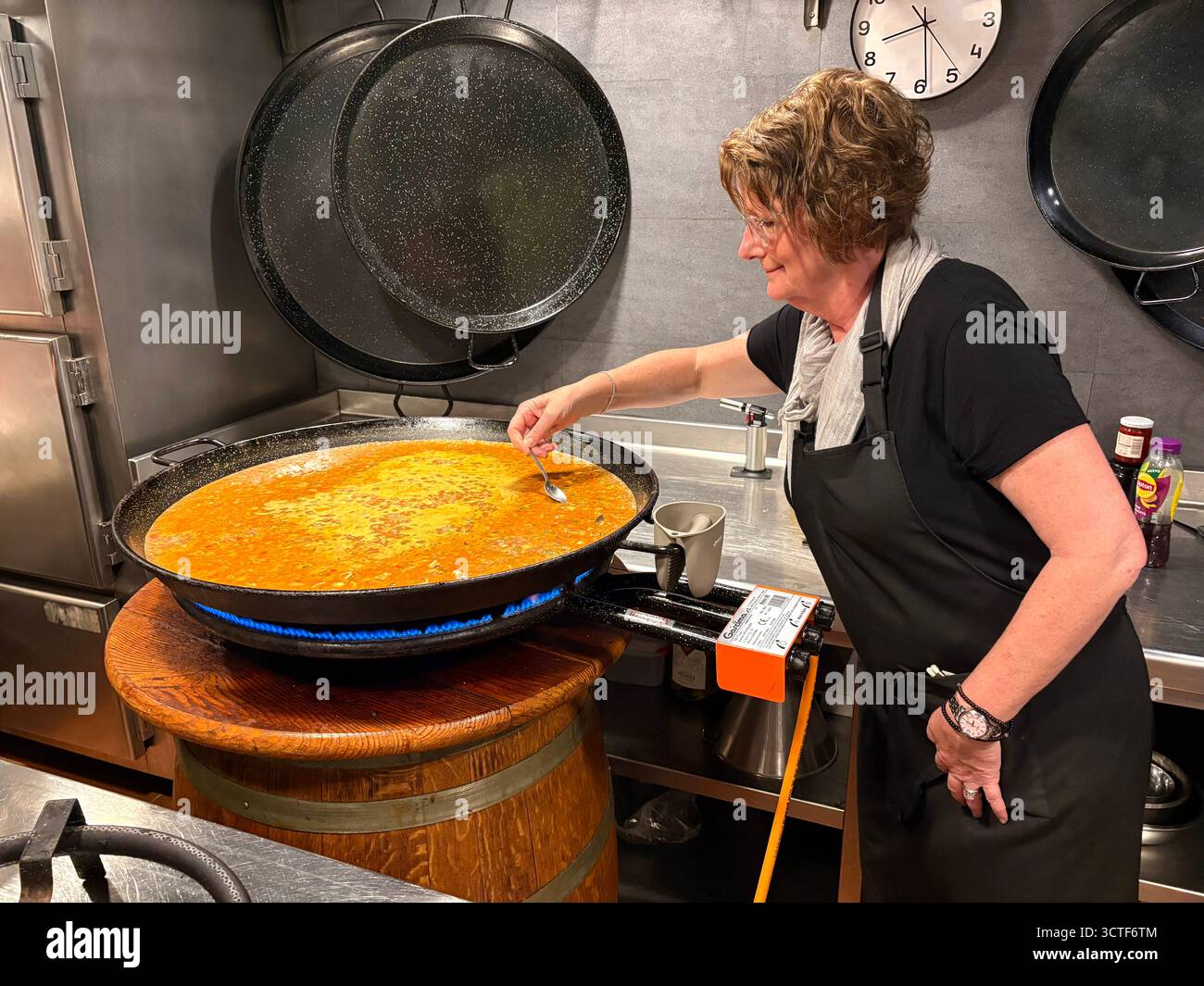 Paella cooking class in Barcelona Spain, model released middle aged ...