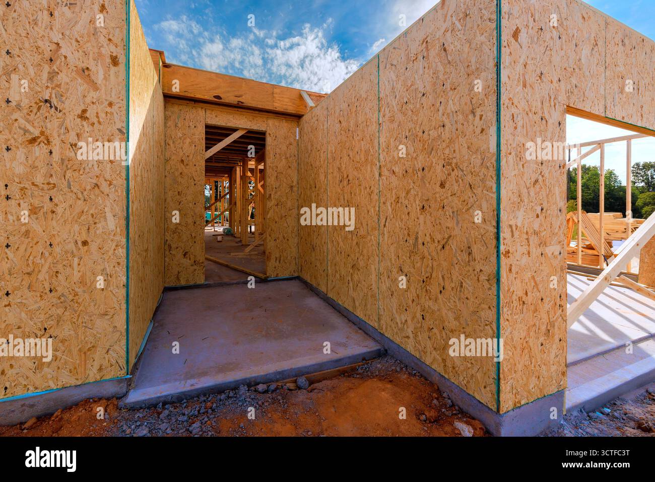 Workers are busy constructing home, walls open spaces on during build ...