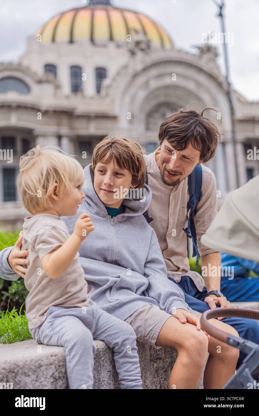 Father tourist with his two sons in front of Palacio de Bellas Artes in ...