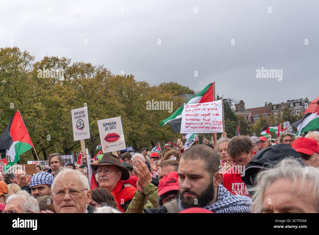 Amsterdam, Netherlands, 05 Oct 2025. Crowd of protesters dressed in red ...
