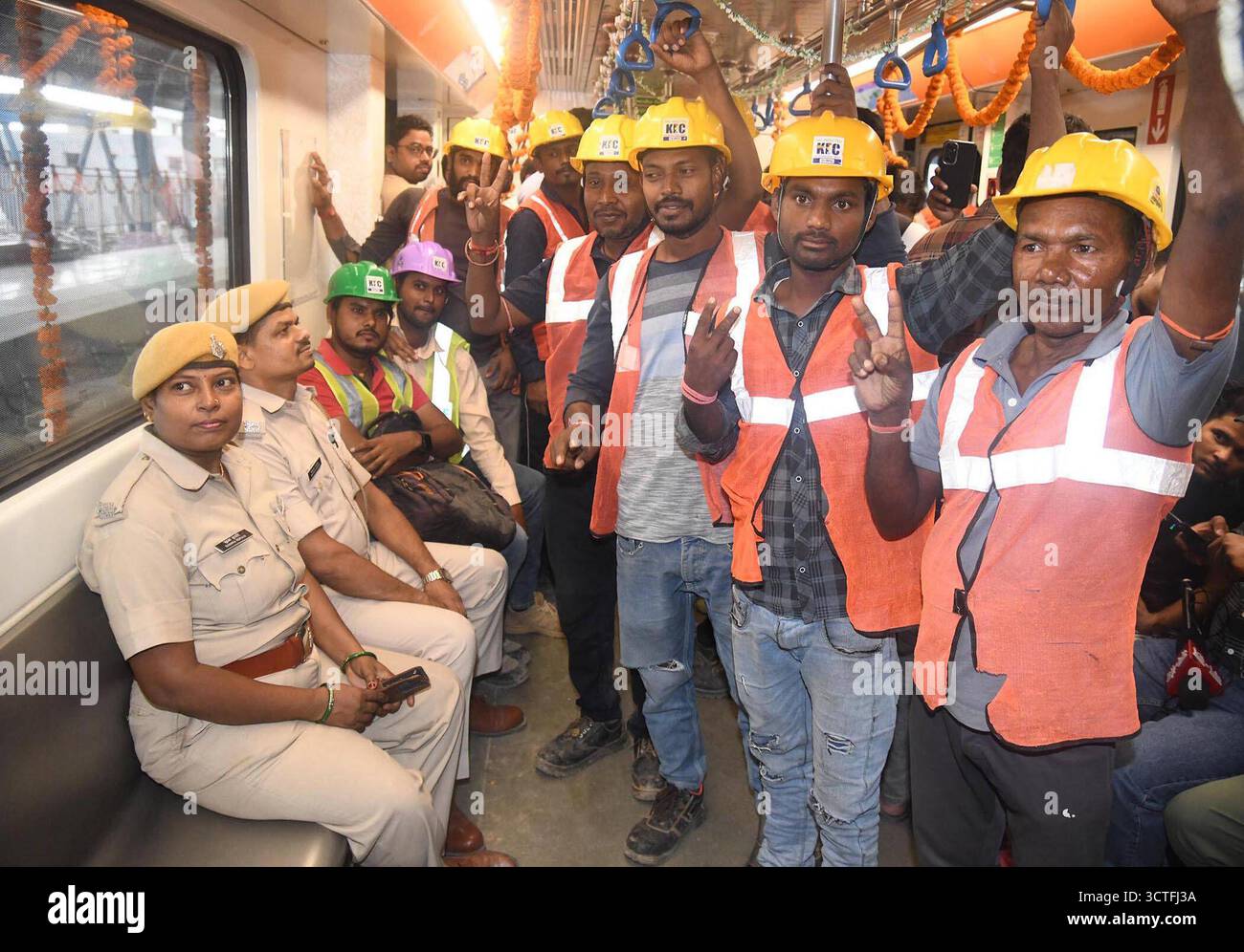PATNA, INDIA - OCTOBER 6: Workers and police personnel travelling after ...