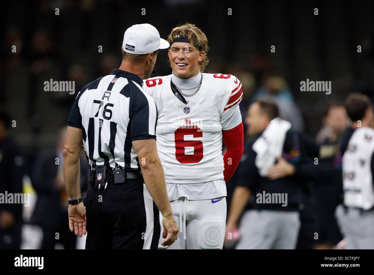 New York Giants quarterback Jaxson Dart (6) talks with an official ...