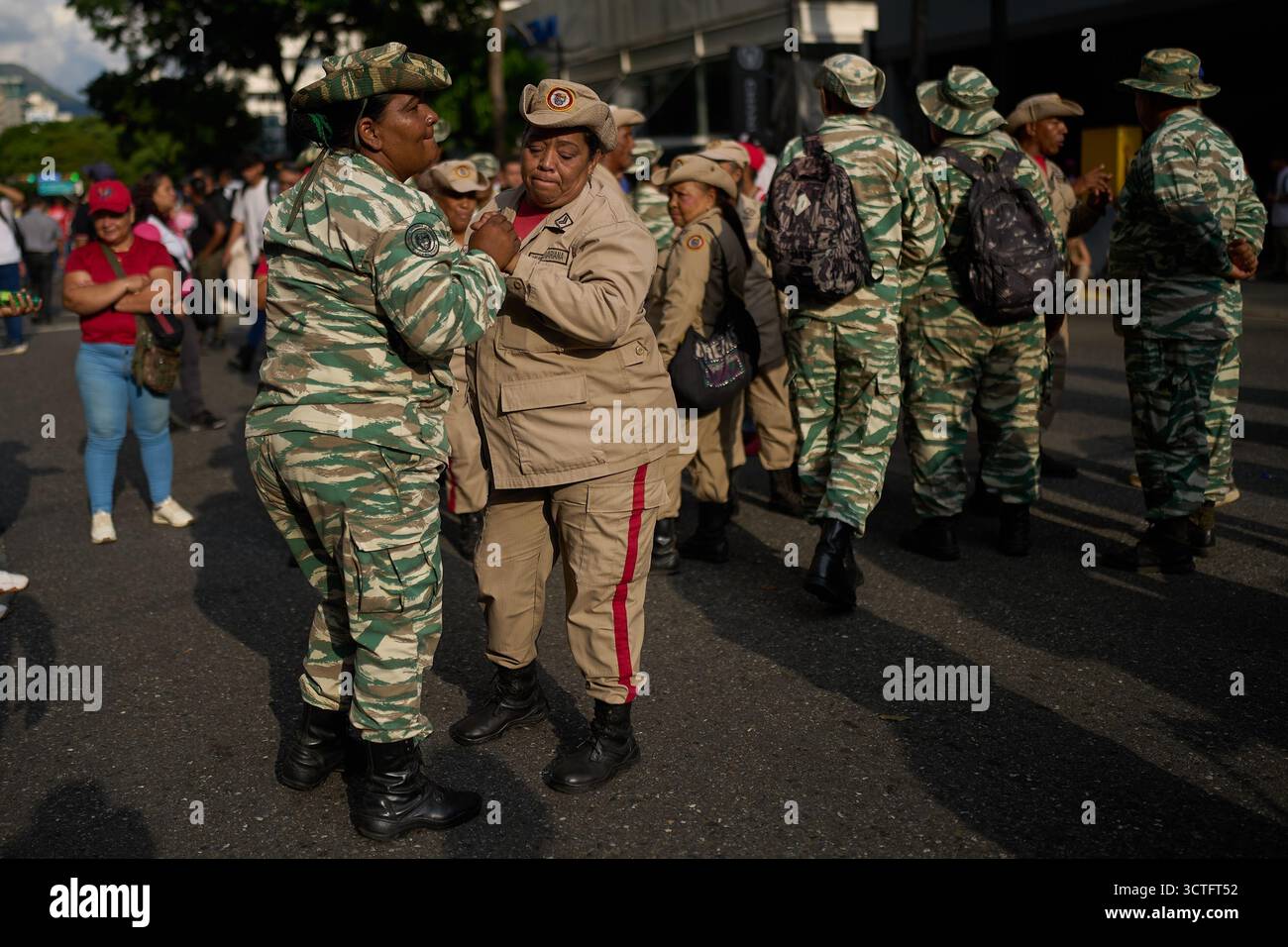 Bolivarian Militia members dance outside of the United Nations' office ...
