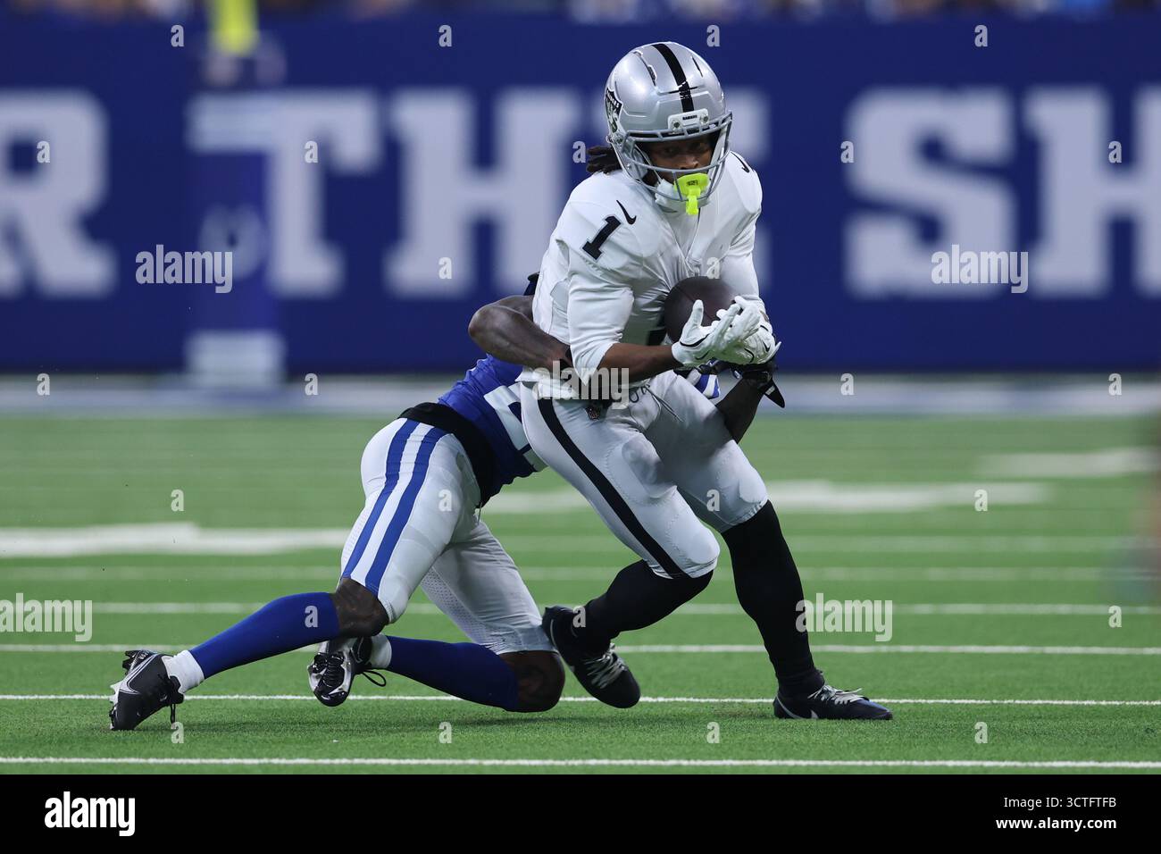 Las Vegas Raiders wide receiver Tre Tucker (1) tries to escape the ...
