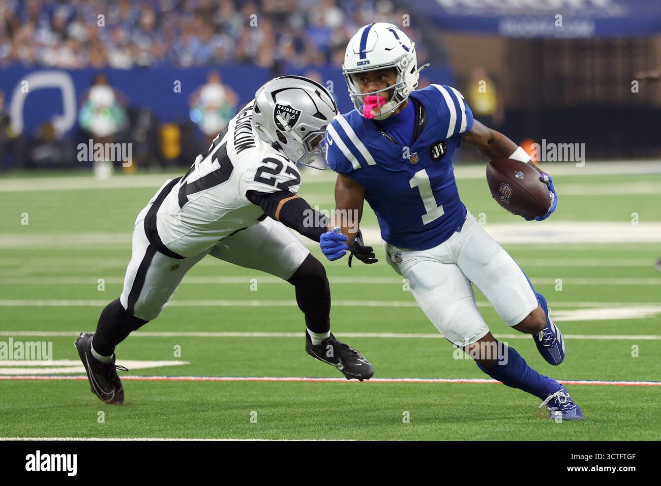 Indianapolis Colts wide receiver Josh Downs (1) tries to avoid the ...