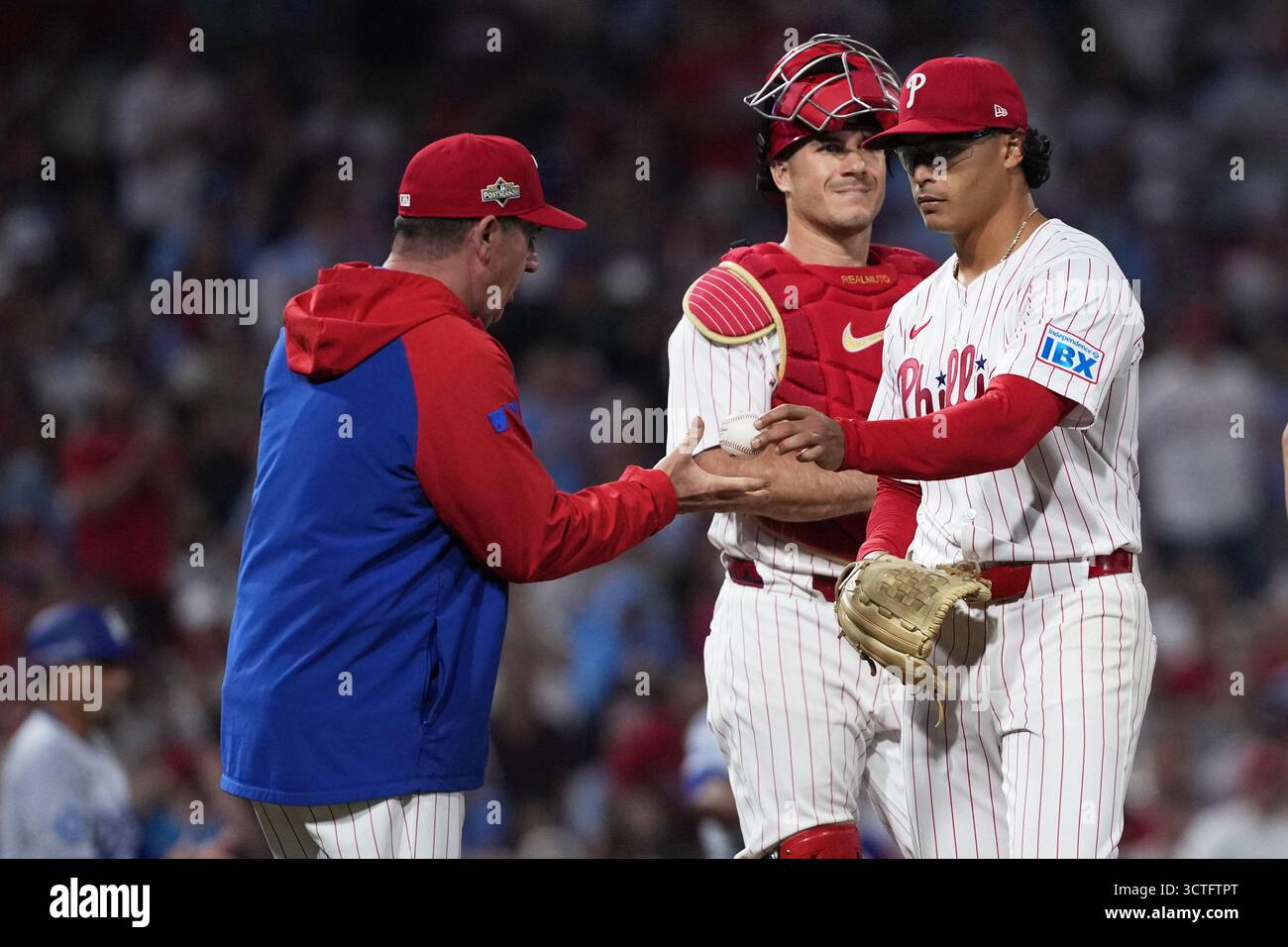 Philadelphia Phillies starting pitcher Jesús Luzardo, right, is relieved by manager Rob Thompson ...