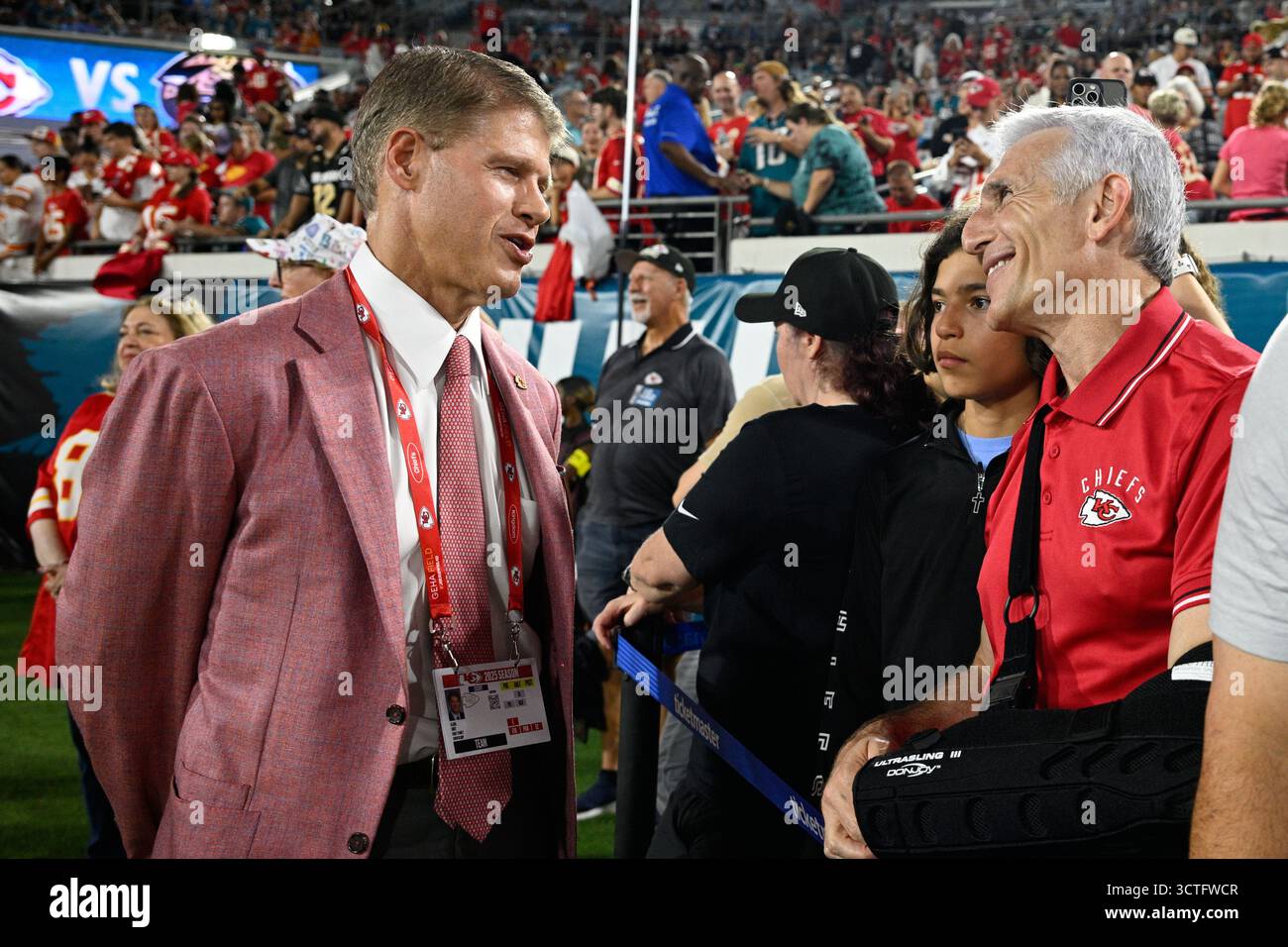 Kansas City Chiefs owner Clark Hunt, left, talks to fans before an NFL ...